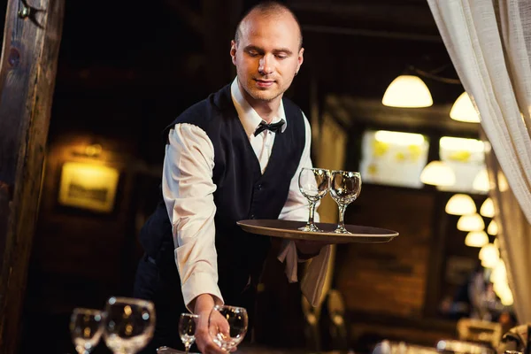 Waiter served table in the restaurant before the feast,Waiter in ...