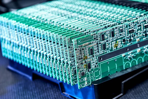Green system boards with microchips and transistors. Microchip ...