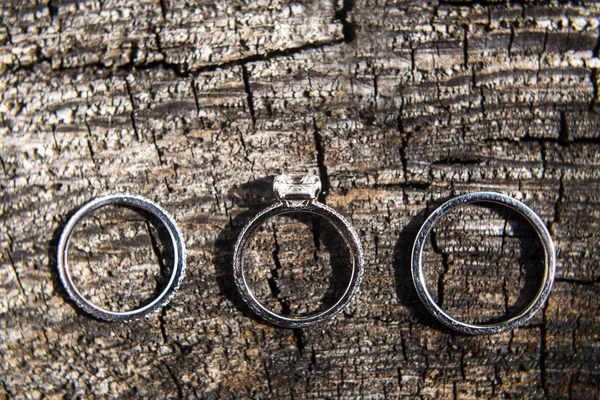 Three wedding rings on a wooden background Stock Photo by ©A ...