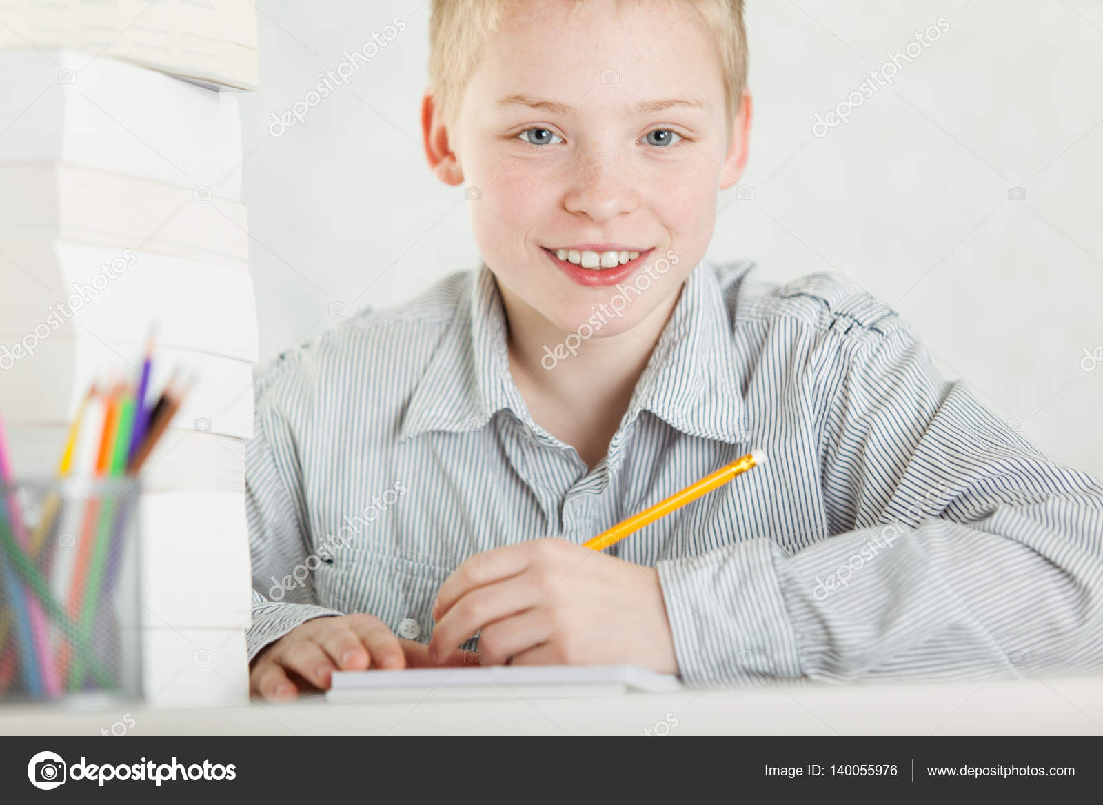 Happy boy doing his homework — Stock Photo © jhandersen #140055976