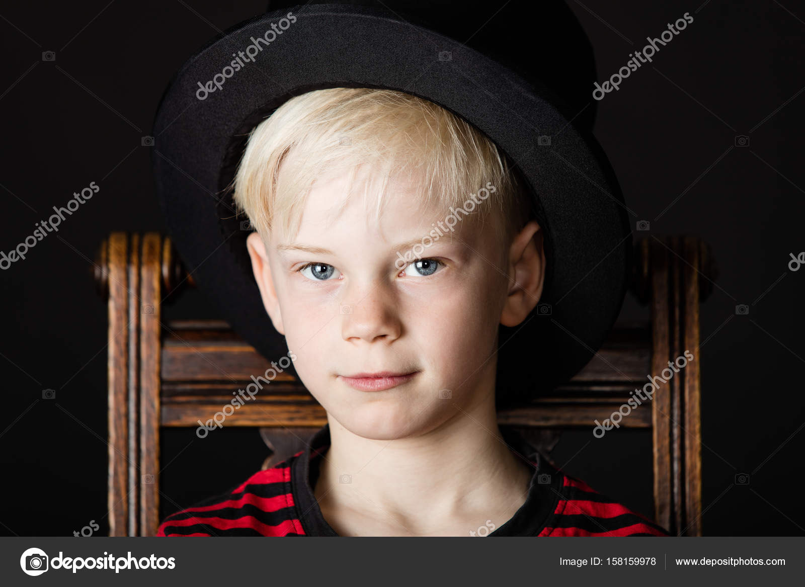 Handsome little boy wearing a black top hat Stock Photo by ©jhandersen ...