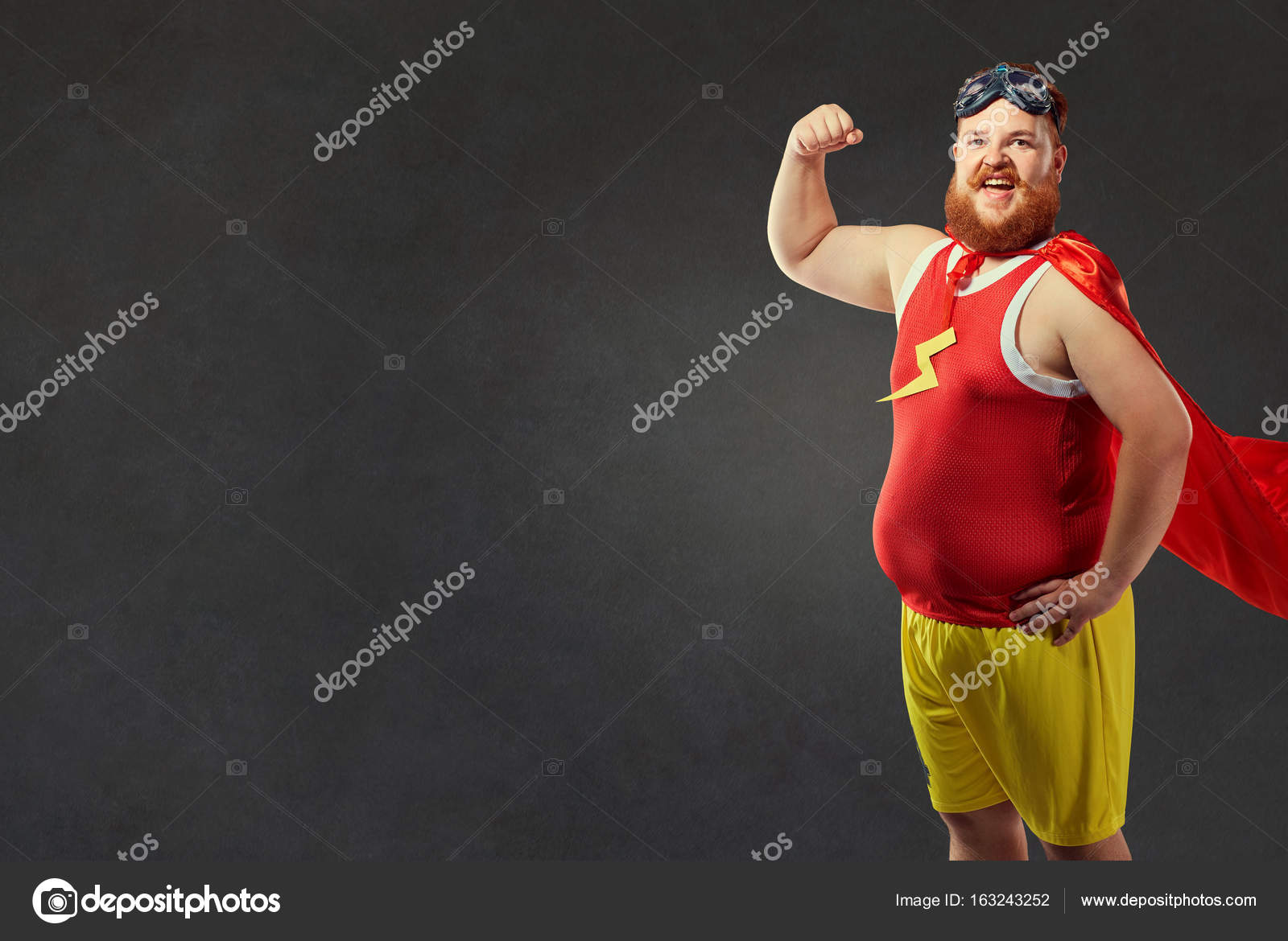 A funny fat man in a superhero costume Stock Photo by ©lacheev 163243252