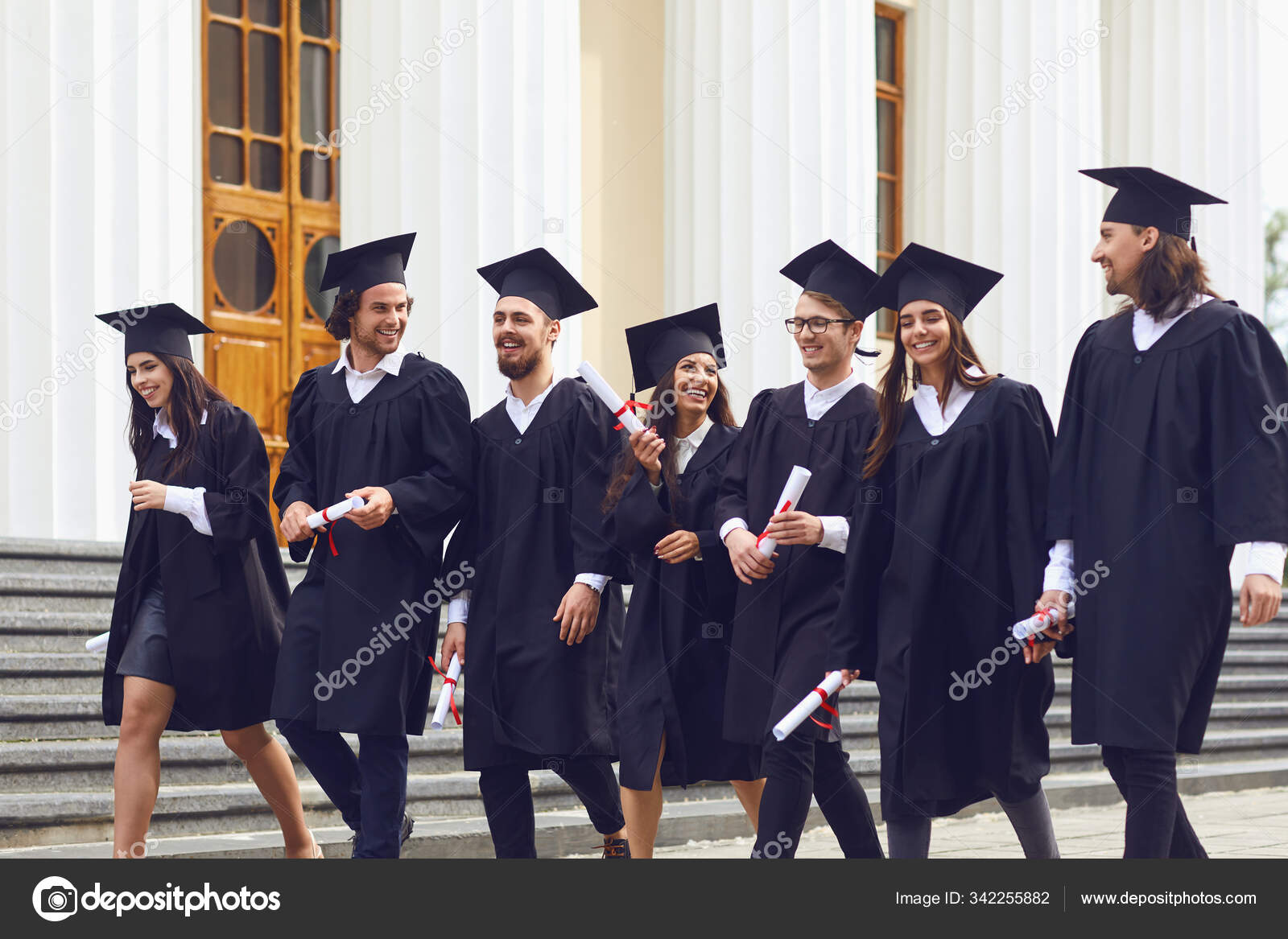 Group of students graduates go against the university college. — Stock ...