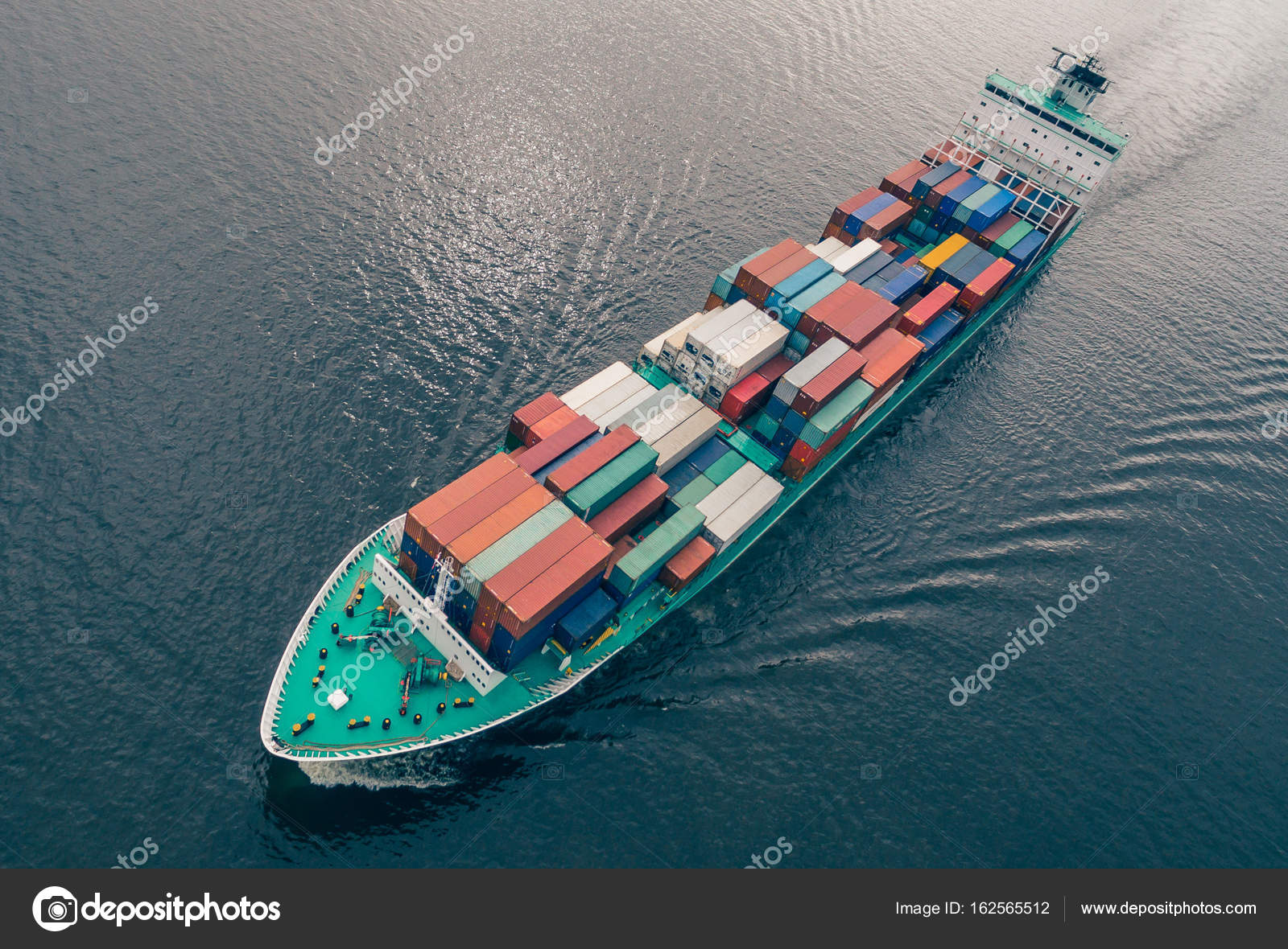 Aerial view of container ship sailing in sea Stock Photo by ©a ...