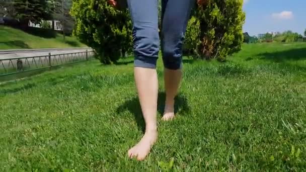 Front view of woman legs in blue tights walking slowly on barefoot on ...