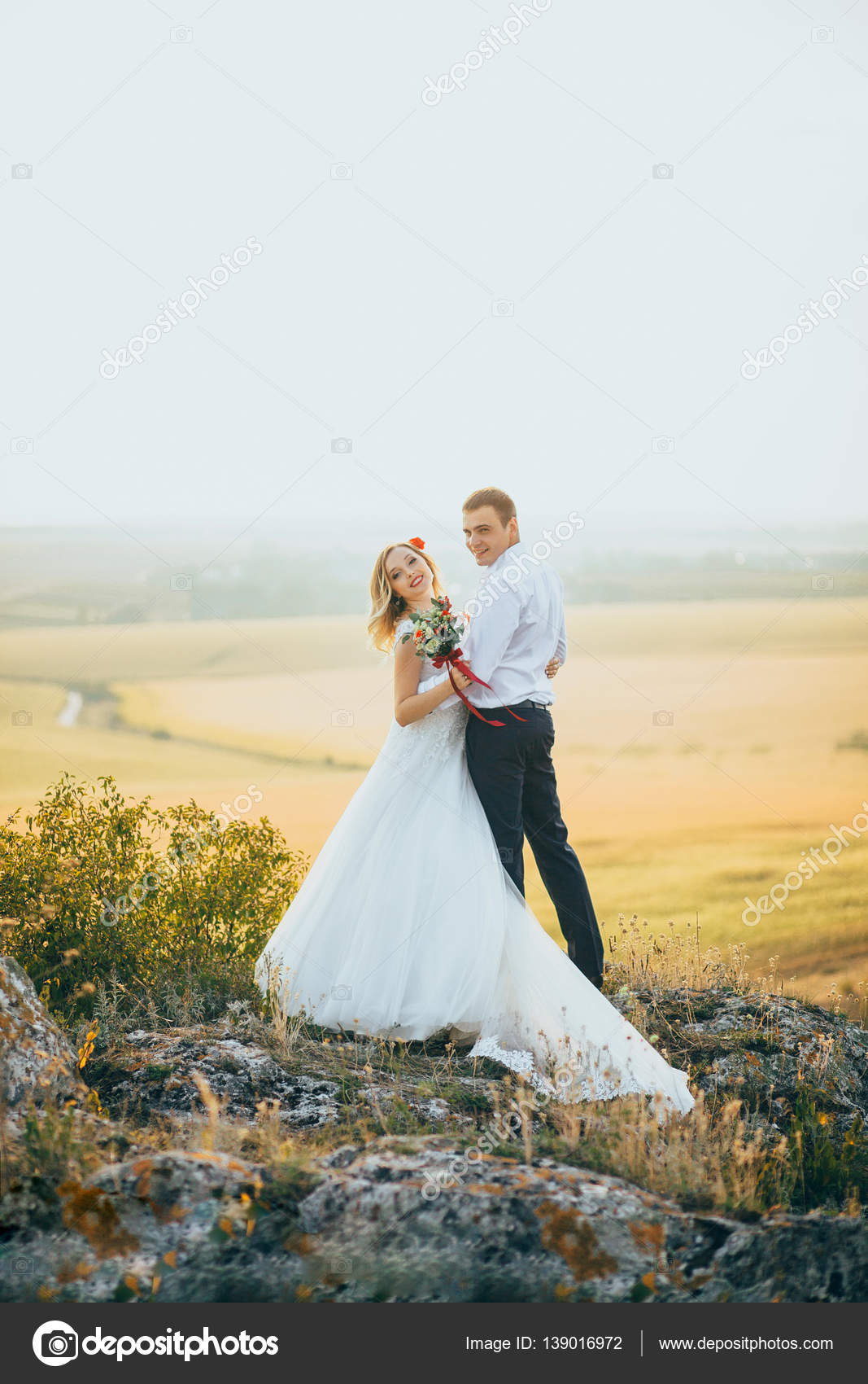 Groom holding bride Stock Photo by ©Amvorsuf 139016972