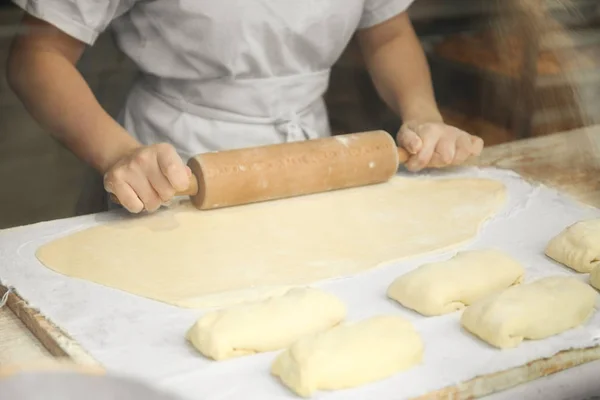 Cook at work is cooking from raw dough. Cooking home baking. - Stock ...