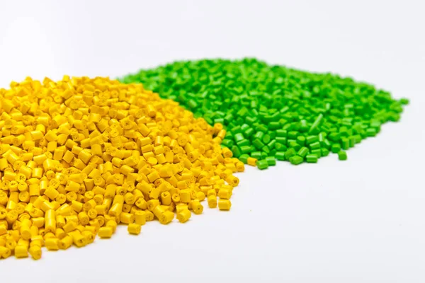 Green and yellow plastic pellets scattered from the measuring Cu ⬇ ...