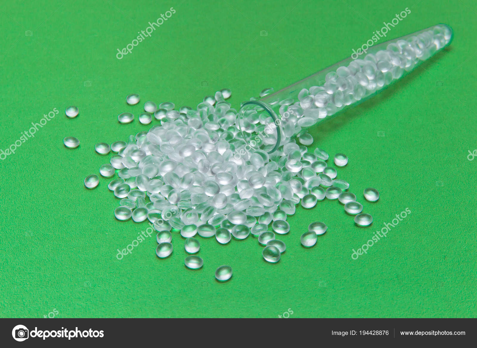 Transparent Polyethylene granules on a green background.The conc Stock ...