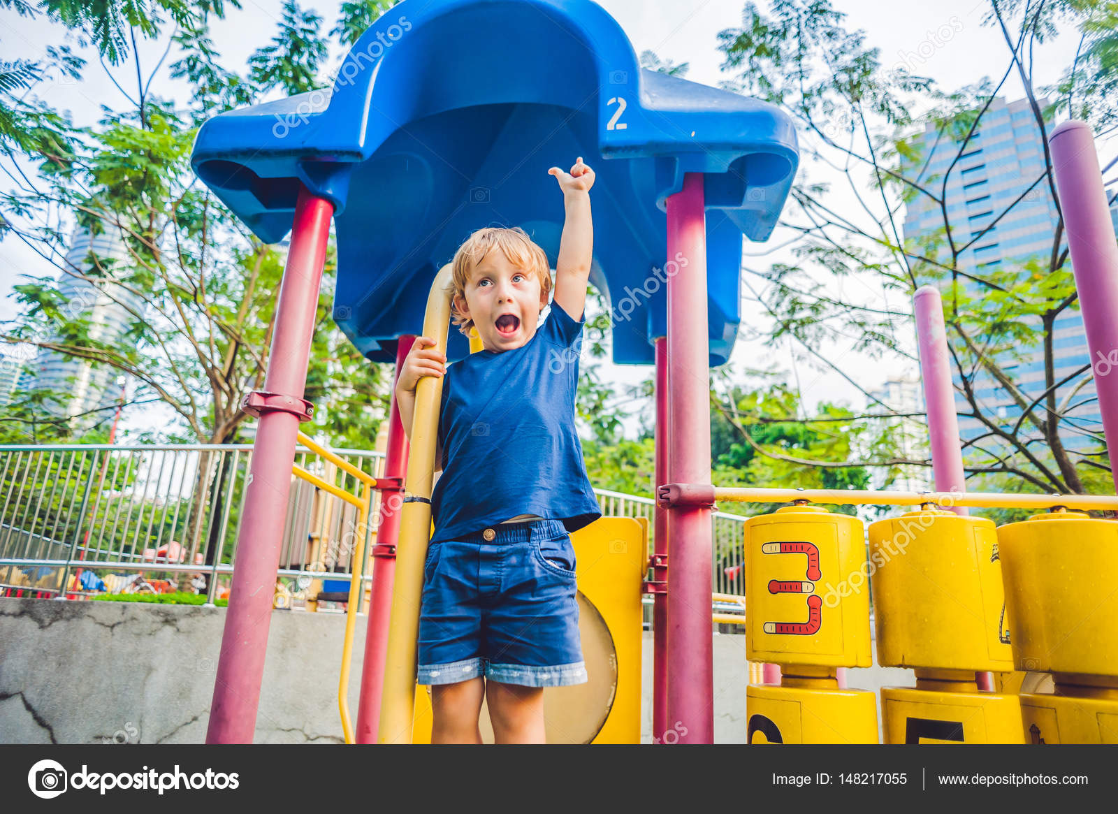 Little kid boy playing at playground. Stock Photo by ©galitskaya 148217055