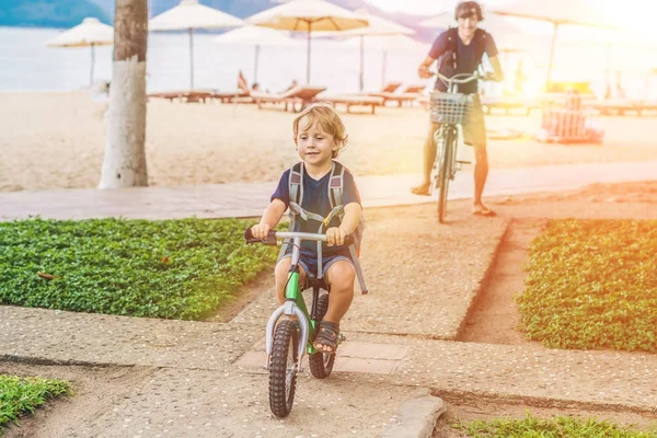 Happy family is riding bikes - Stock Image - Everypixel