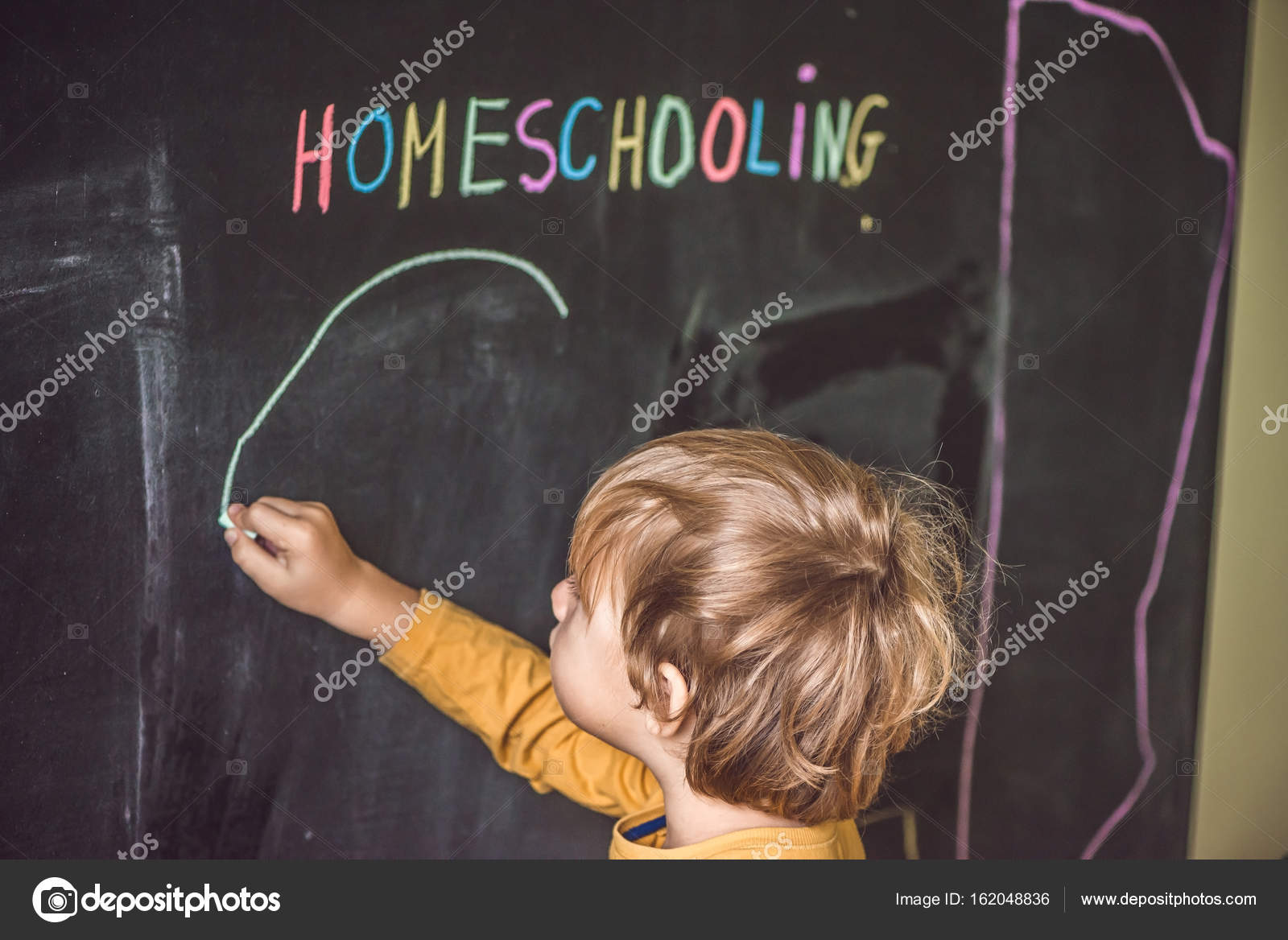 Boy is drawing under word Homeschooling Stock Photo by ©galitskaya ...