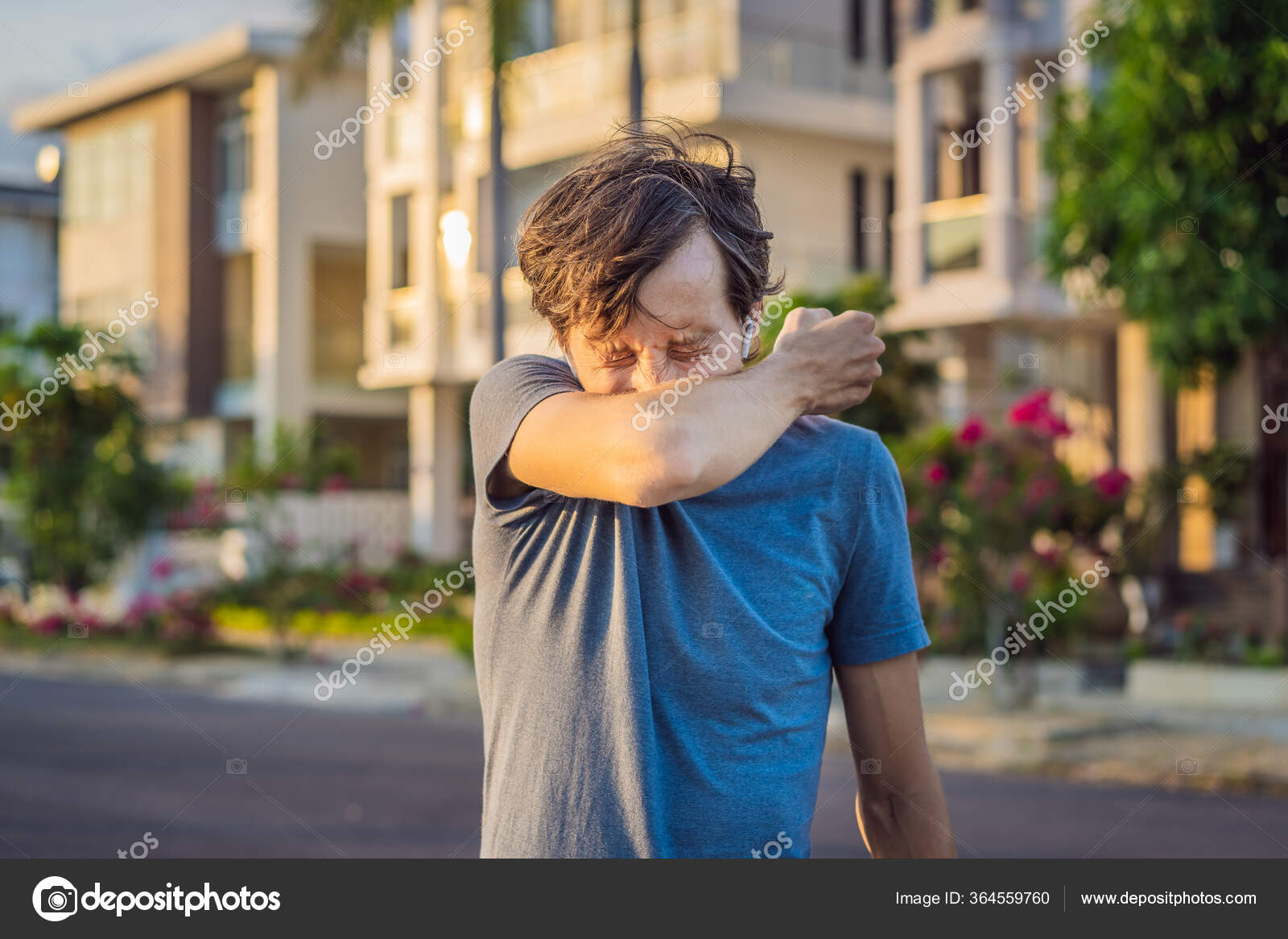 How to sneeze correctly. Man sneezes on the elbow. Concept of the ...