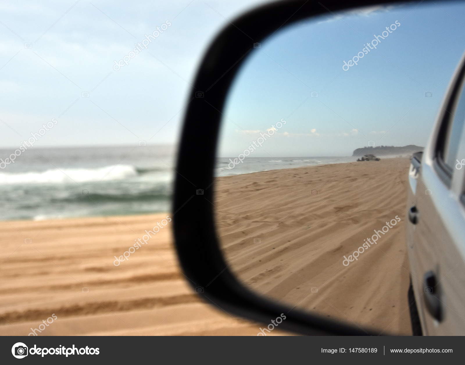 Car driving on beach Stock Photo by ©katacarix 147580189
