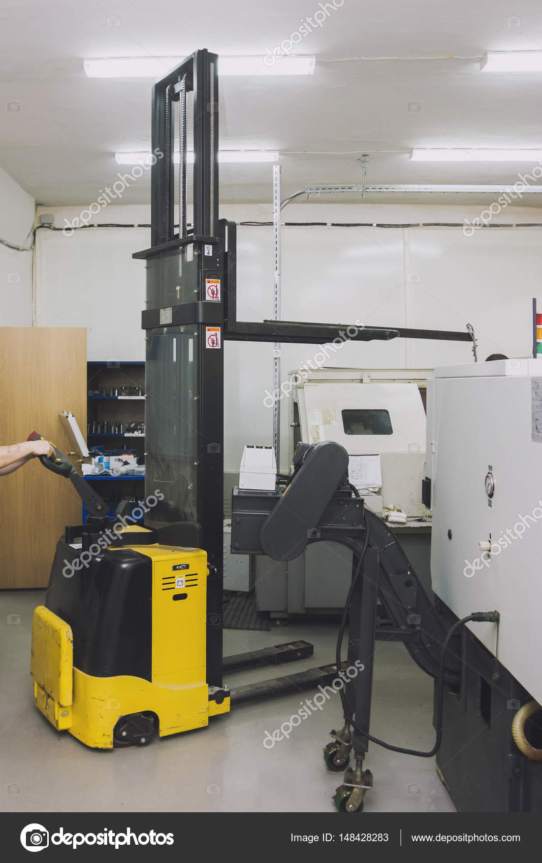 Warehouse forklift stacker loader stacking cardboxes in metal industry ...