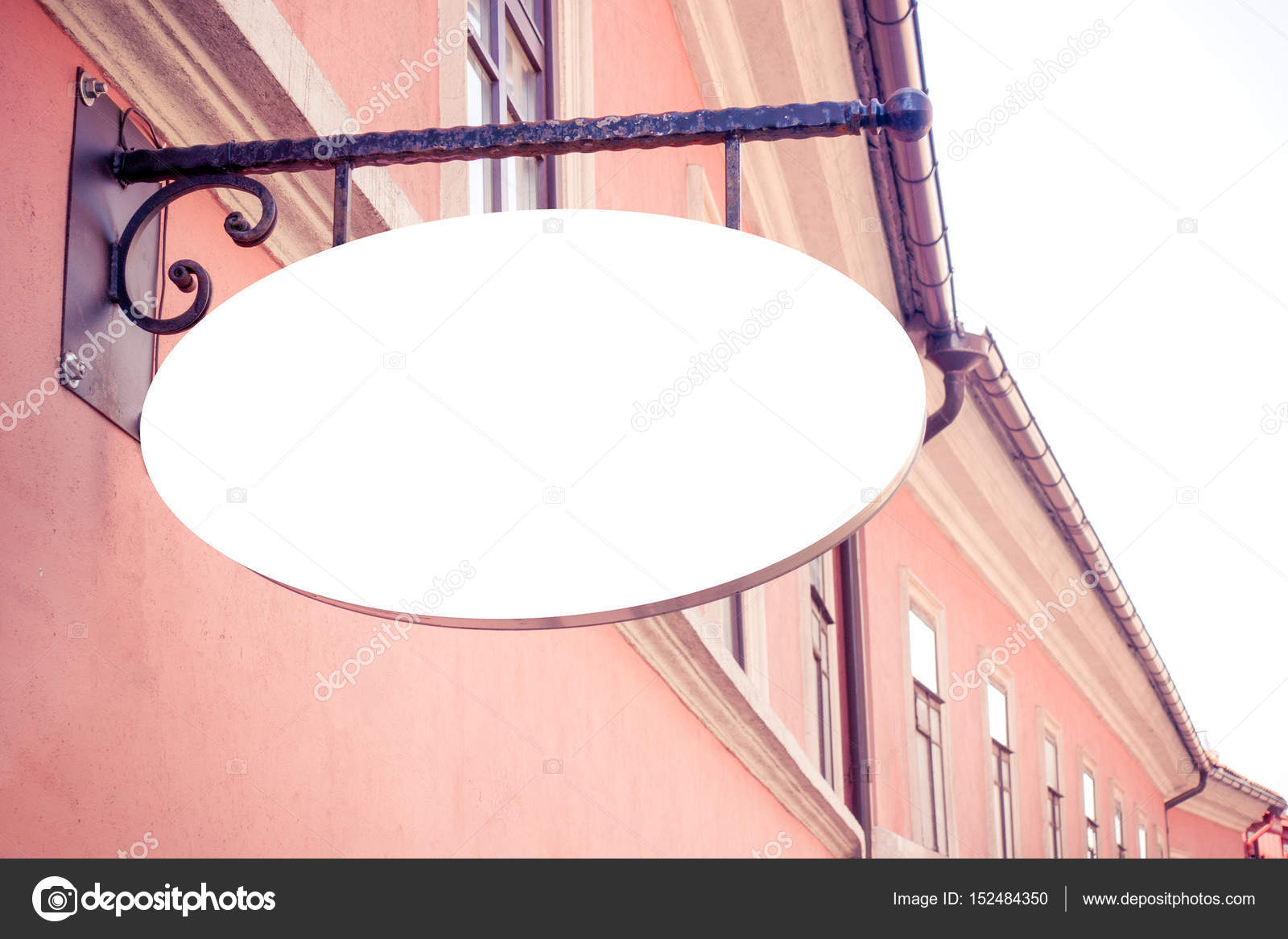 Mock up sign. Blank rounded signage on a building with classical ...