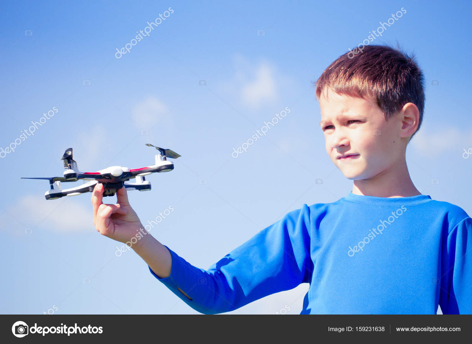 Boy playing with drone outdoors. Stock Photo by ©Vejaa 159231638
