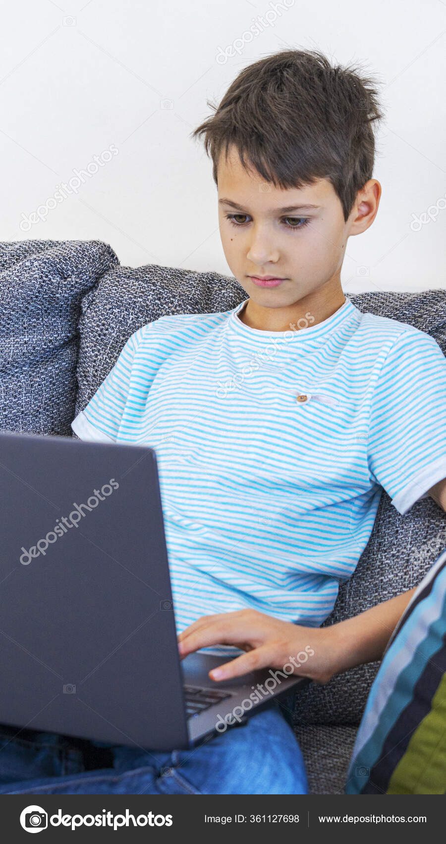 Preteen boy using laptop computer at home. Technology, online learning ...