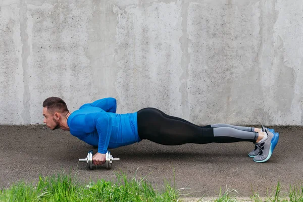 Muscular bodybuilder guy doing push-ups - Stock Image - Everypixel