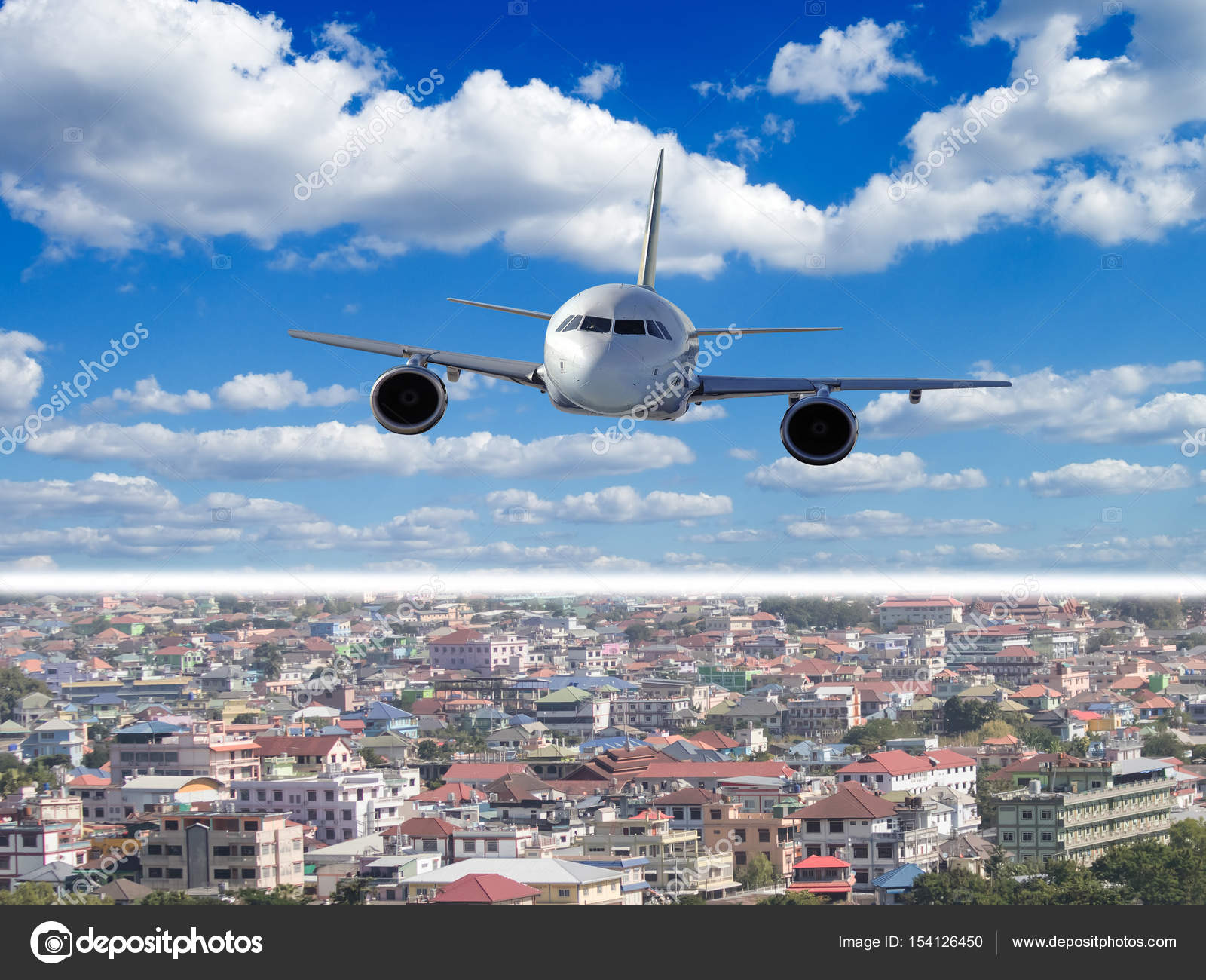 Airplane Flying Over City