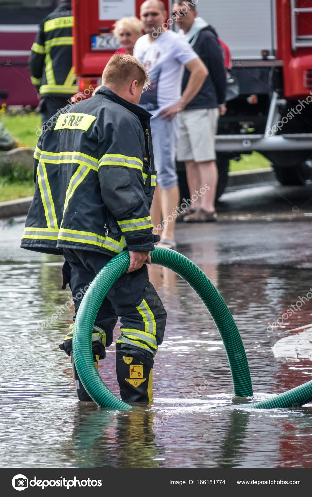 Firefighters pumping out water – Stock Editorial Photo © pawopa3336 ...