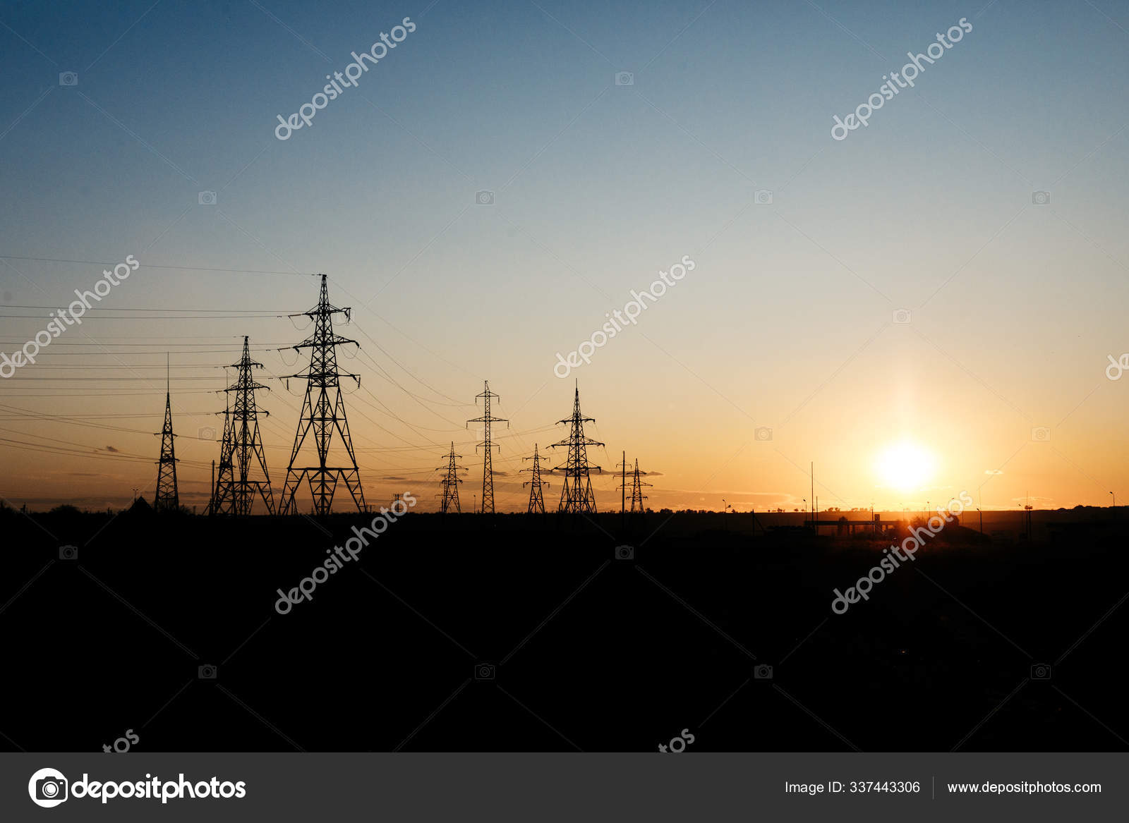 Power lines on the filed on sunset. Save the planet and electricity ...