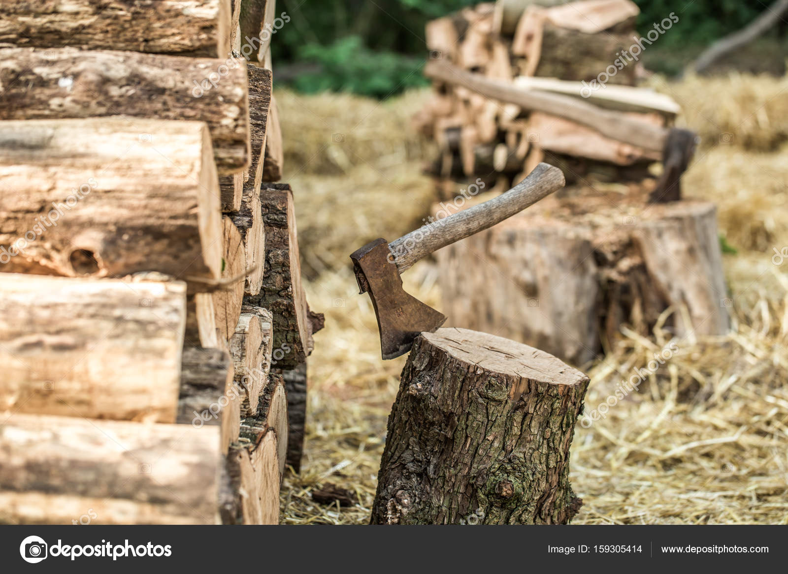 A deck of stacked logs and an axe — Stock Photo © puhimec #159305414