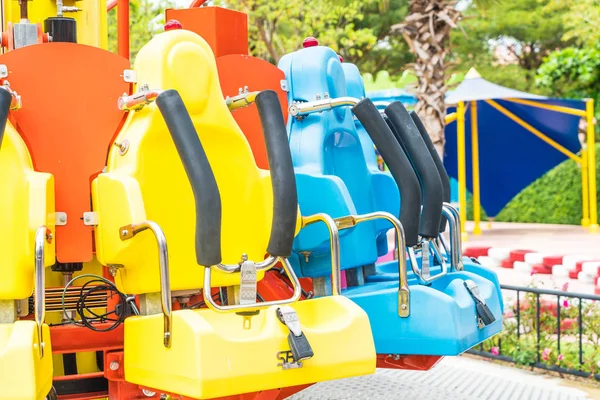 Colorful roller coaster seats at amusement park — Stock Photo © topntp ...