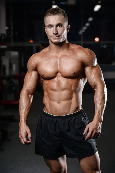 Handsome fitness model train in the gym gain muscle - Stock Image ...