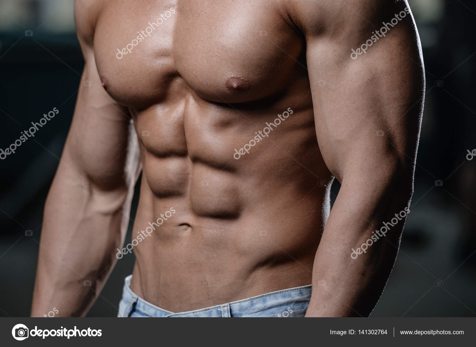 Close up strong abs guy showing in the gym muscles Stock Photo by ©antondotsenko 141302764
