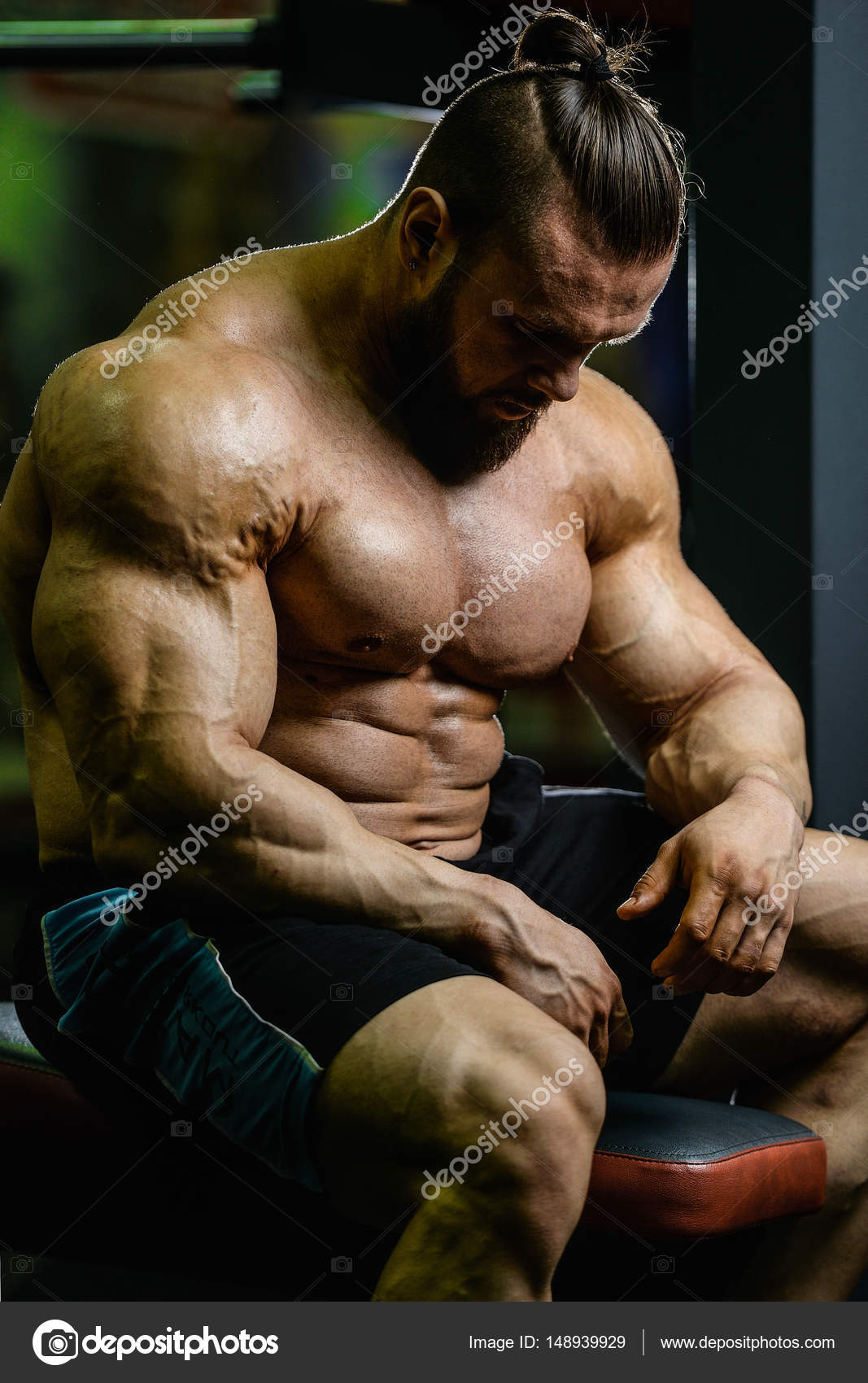 Handsome fit caucasian muscular man flexing his muscles in gym Stock ...