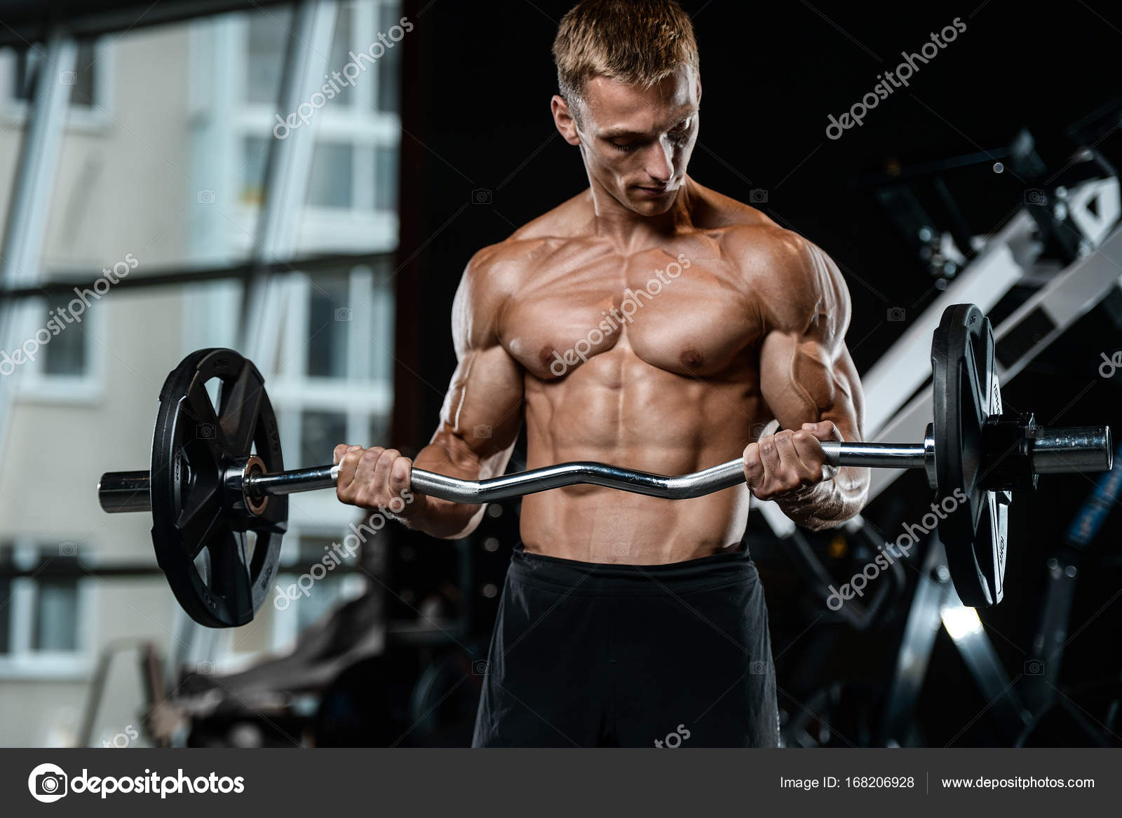 Handsome model young man working out in gym — Stock Photo ...
