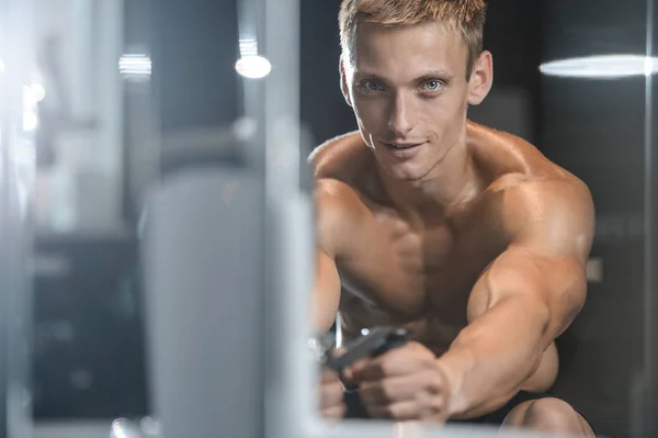 Handsome model young man training back in gym - Stock Image - Everypixel