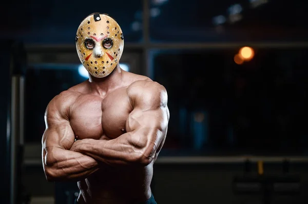 Horror brutal Jason mask man strong bodybuilder athletic fitness Stock ...