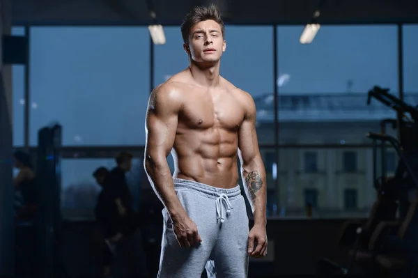 Handsome model young man workout in gym - Stock Image - Everypixel