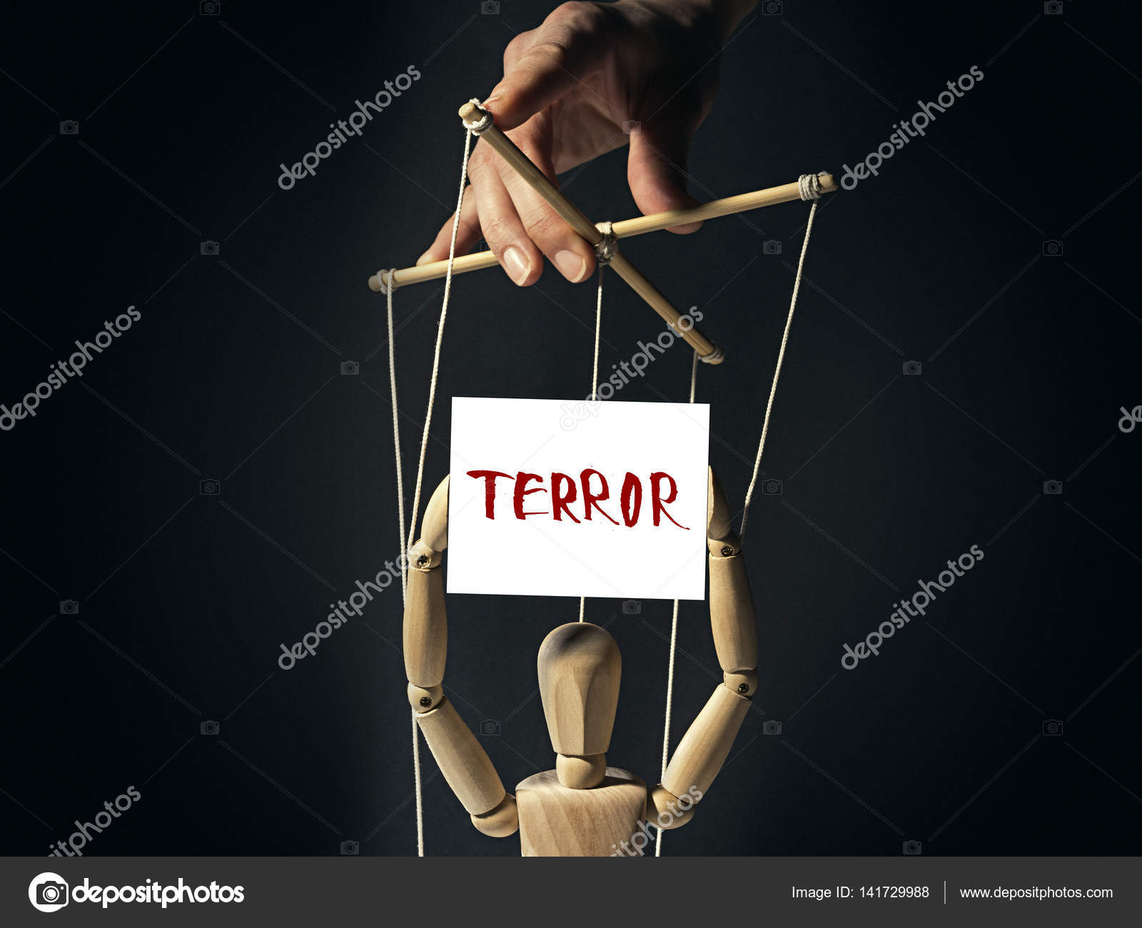 Puppet with a banner "terror" Stock Photo by ©SvetaZi 141729988