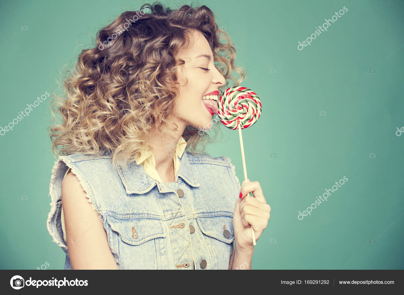 Young woman posing with lollipop Stock Photo by ©sigma1850 169291292
