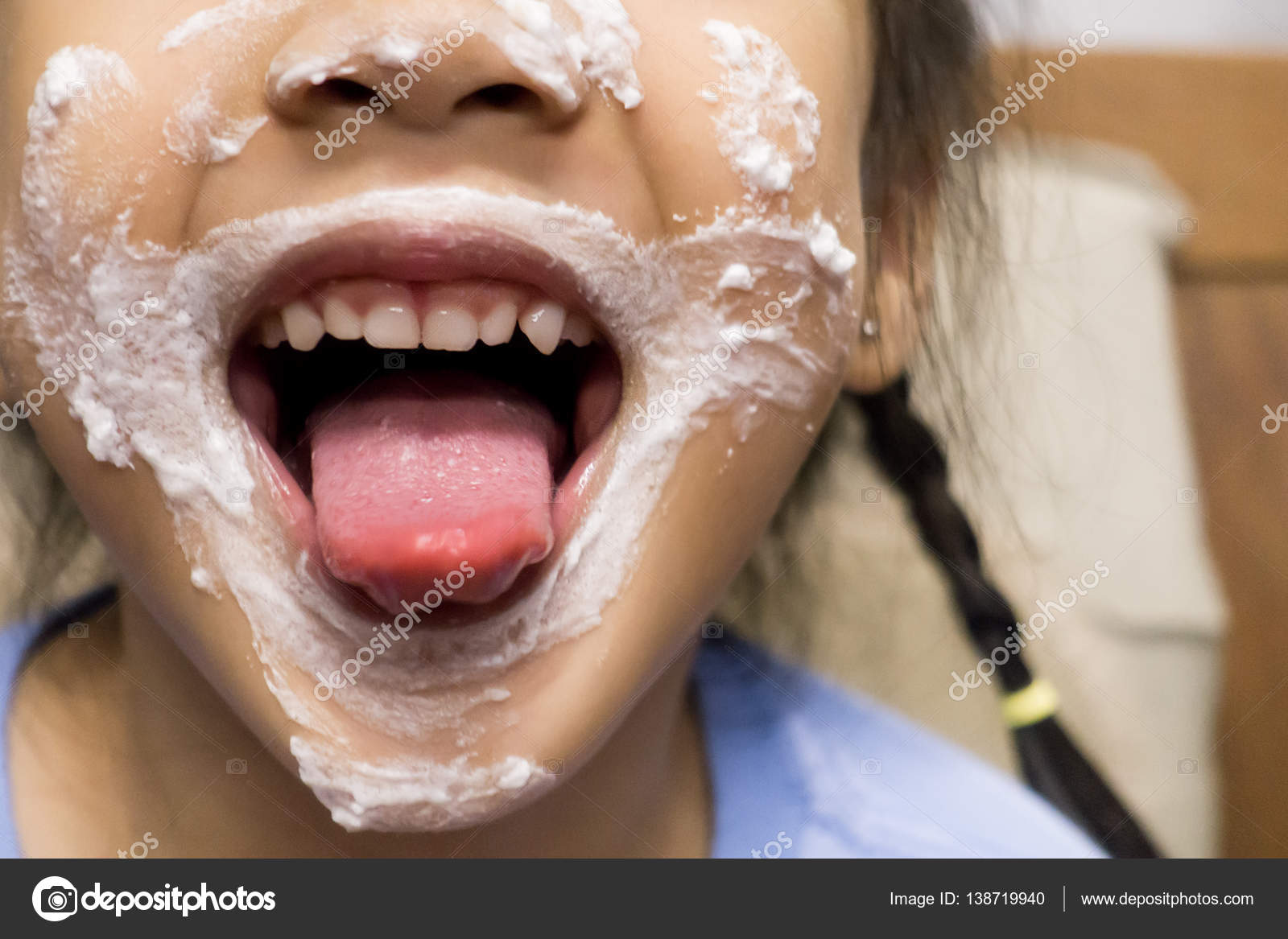 Girl open mouth with face full of cream from cake Stock Photo by ...