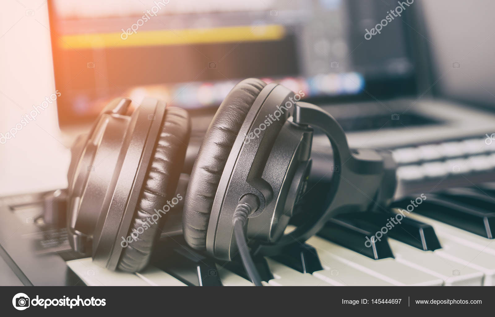 Black Music Studio headphone lying on working desktop — Stock Photo ...