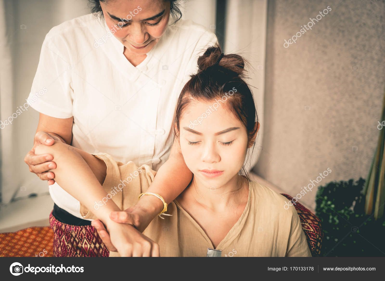 Women Is Getting Shoulder And Elbow Massage In Thai Massage Spa Stock