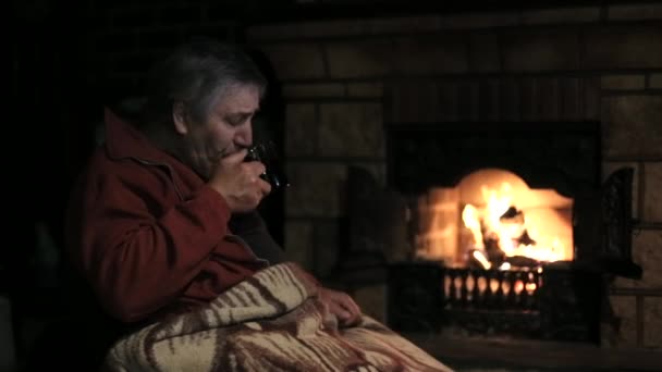 Elderly People Sitting By Fireplace