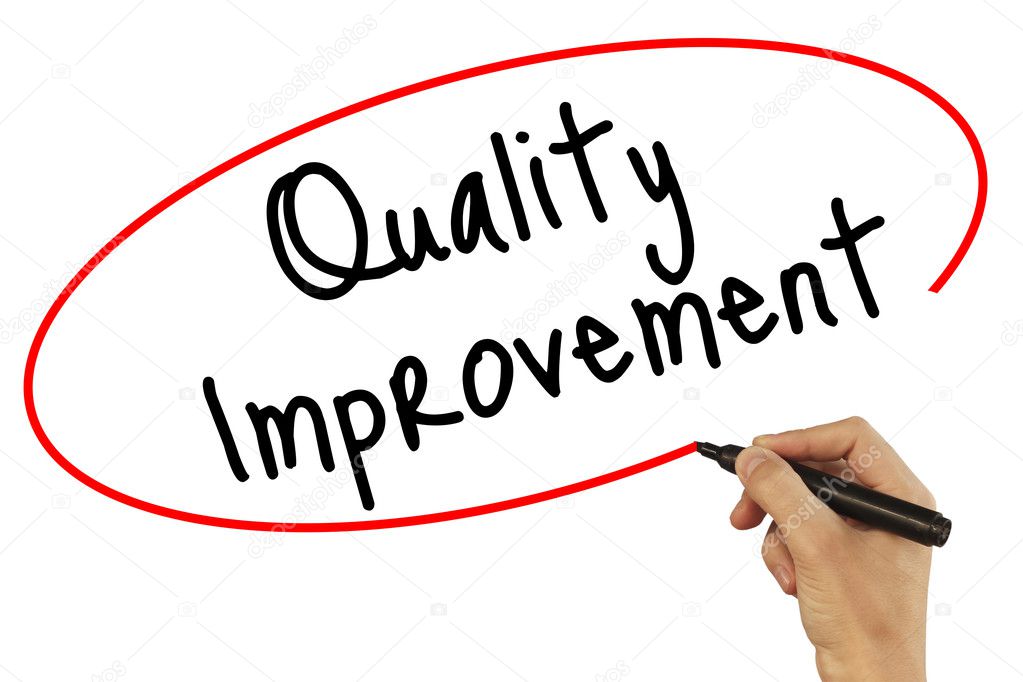 Man Hand writing Quality Improvement with black marker on visual ...