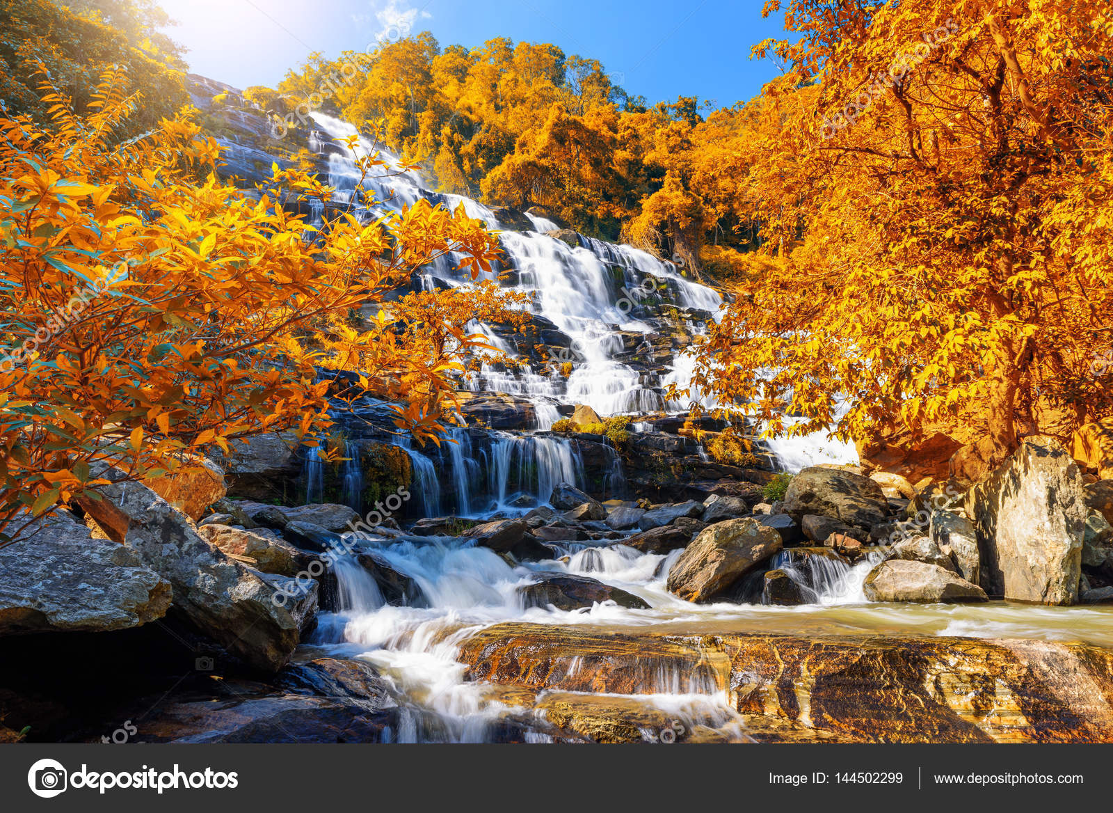 Mae Ya waterfall with green trees and blue sky backgroundat Doi ...
