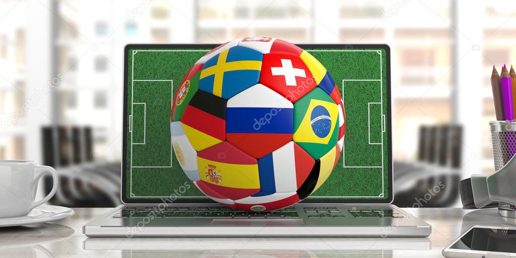 F tbol bal n de f tbol con banderas del mundo en un teclado de ordenador, fondo borroso oficina ...
