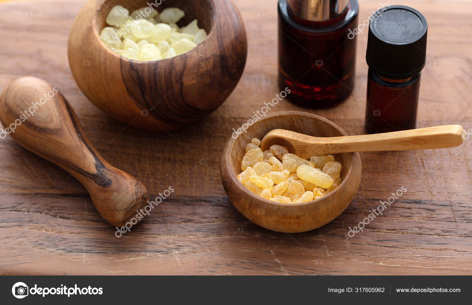 Chios mastic tears and essential oil on wood background Stock Photo by ...