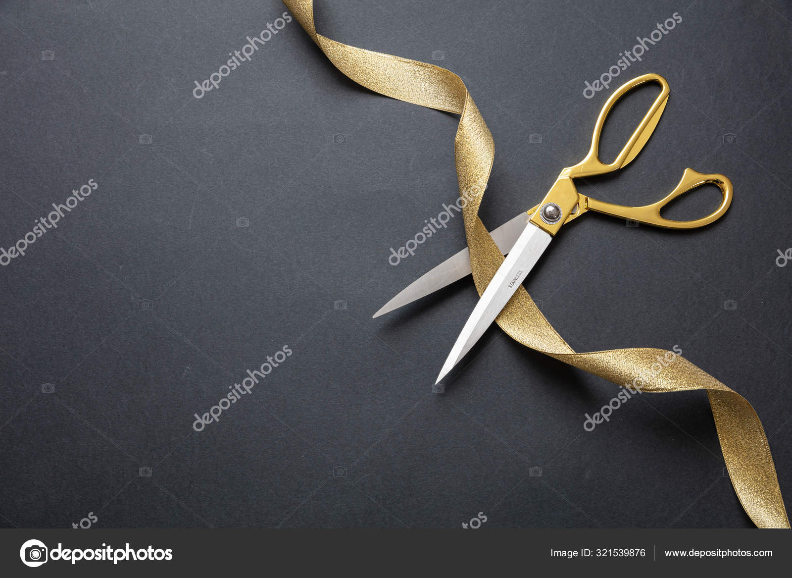 Grand opening. Gold scissors cutting gold satin ribbon, black ...
