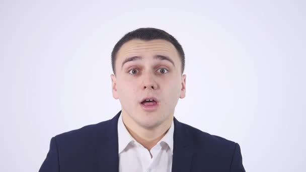 Handsome young man with brown long hair and wearing white shirt and ...