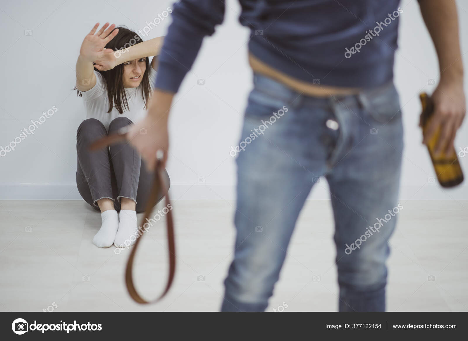 Man threating and beating his wife at home with a belt. — Stock Photo ...