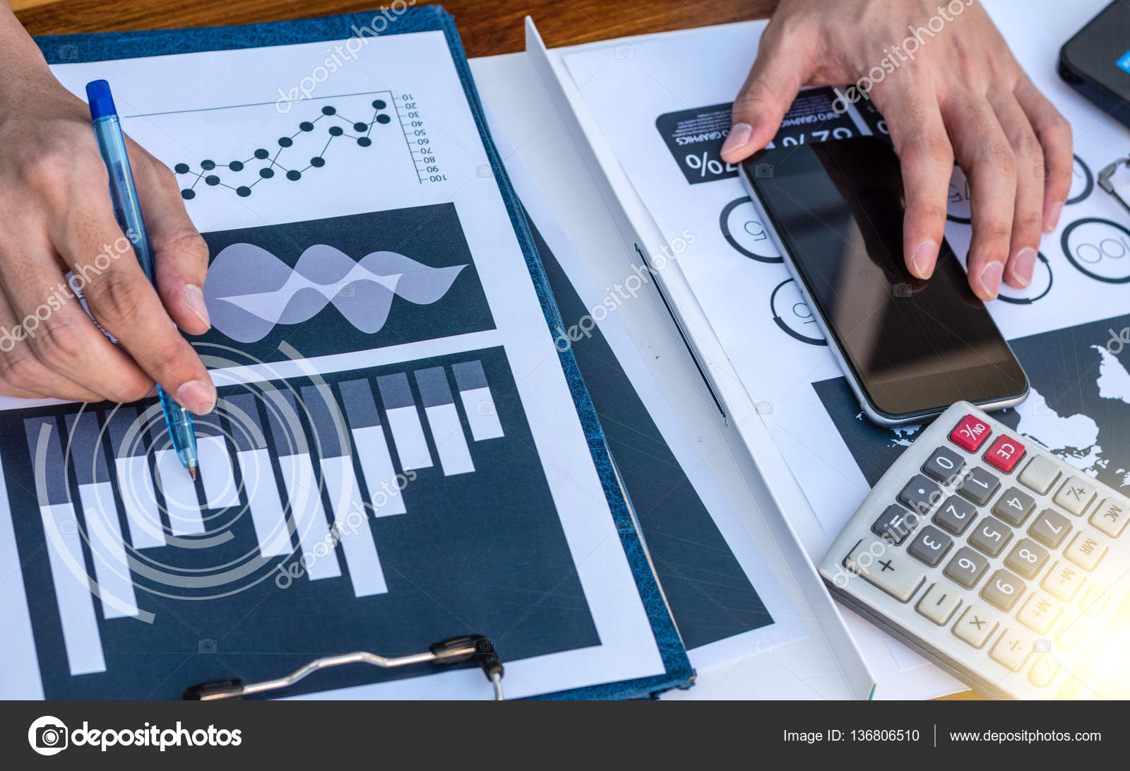 Business workers discussing digital graphs and diagrams indicati Stock ...