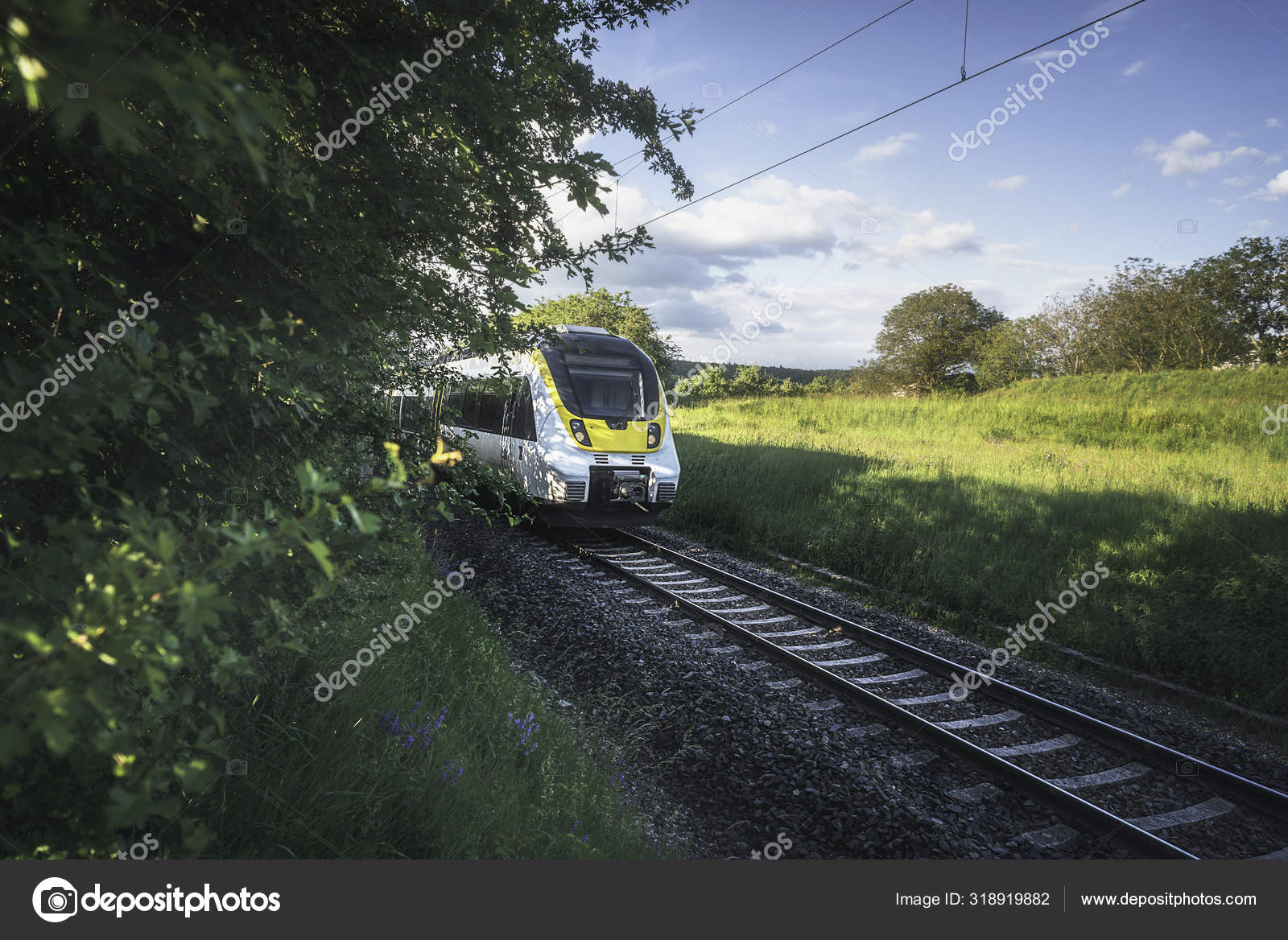 German train traveling through spring countryside scenery Stock Photo ...
